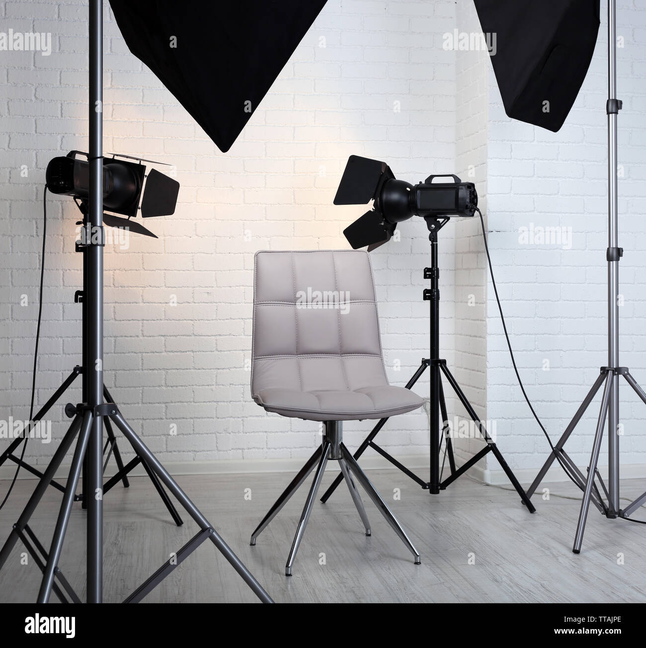 Photo studio with modern interior and lighting equipment Stock Photo ...