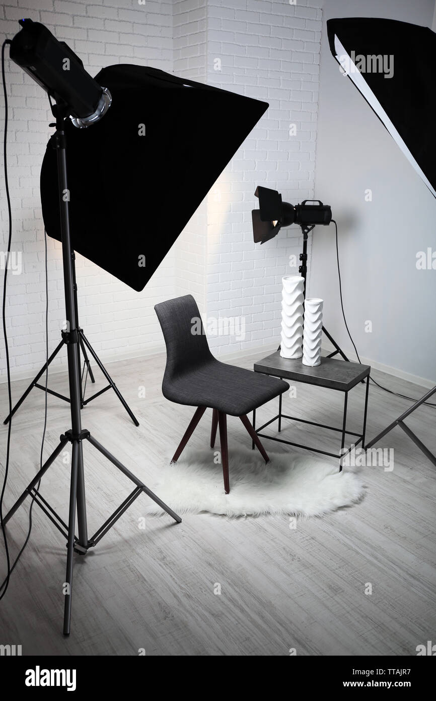 Photo studio with modern interior and lighting equipment Stock Photo ...