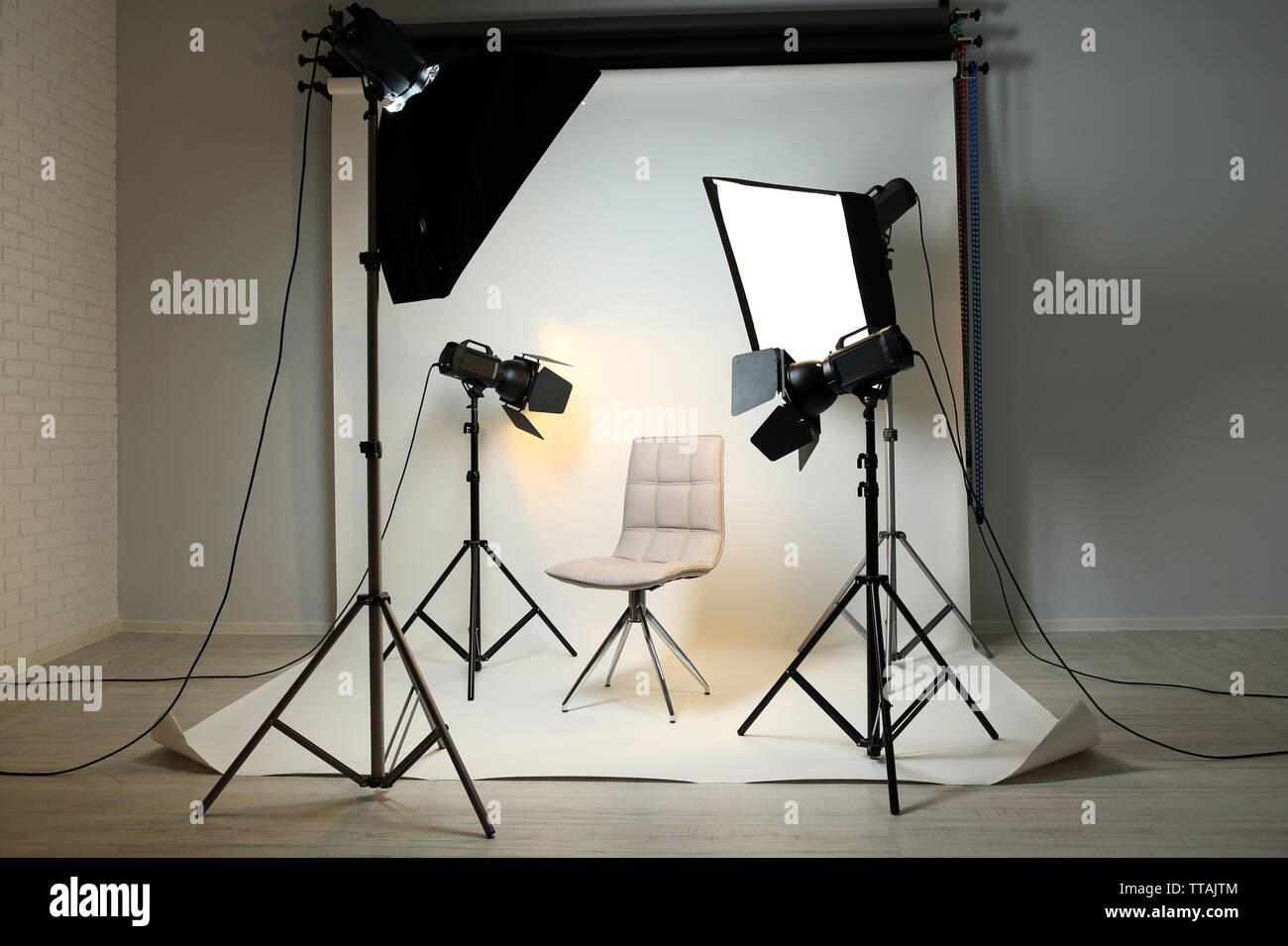 Photo studio with modern interior and lighting equipment Stock Photo ...