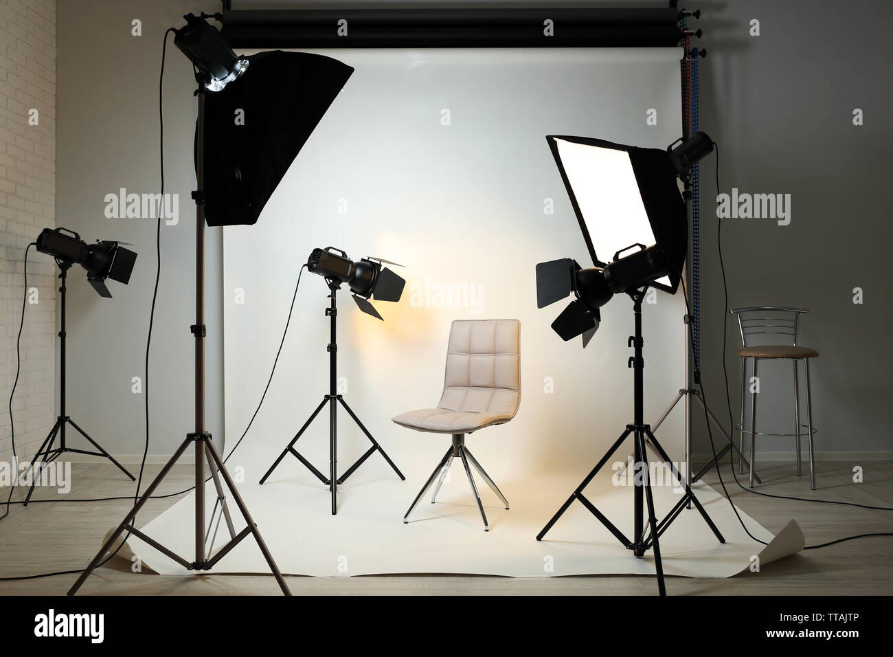 Photo studio with modern interior and lighting equipment Stock Photo ...