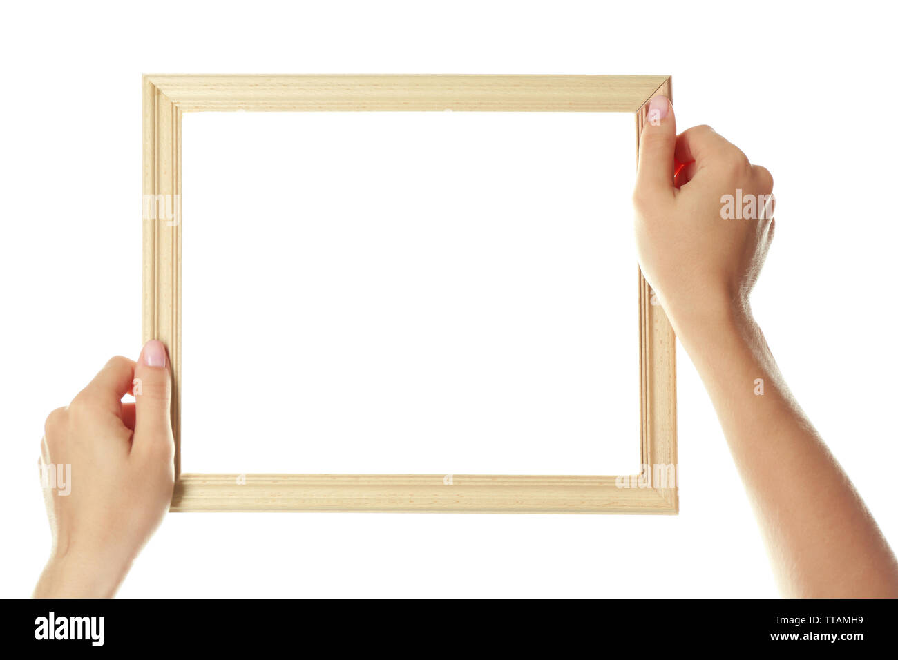 Female hands with wooden frame, isolated on white Stock Photo - Alamy
