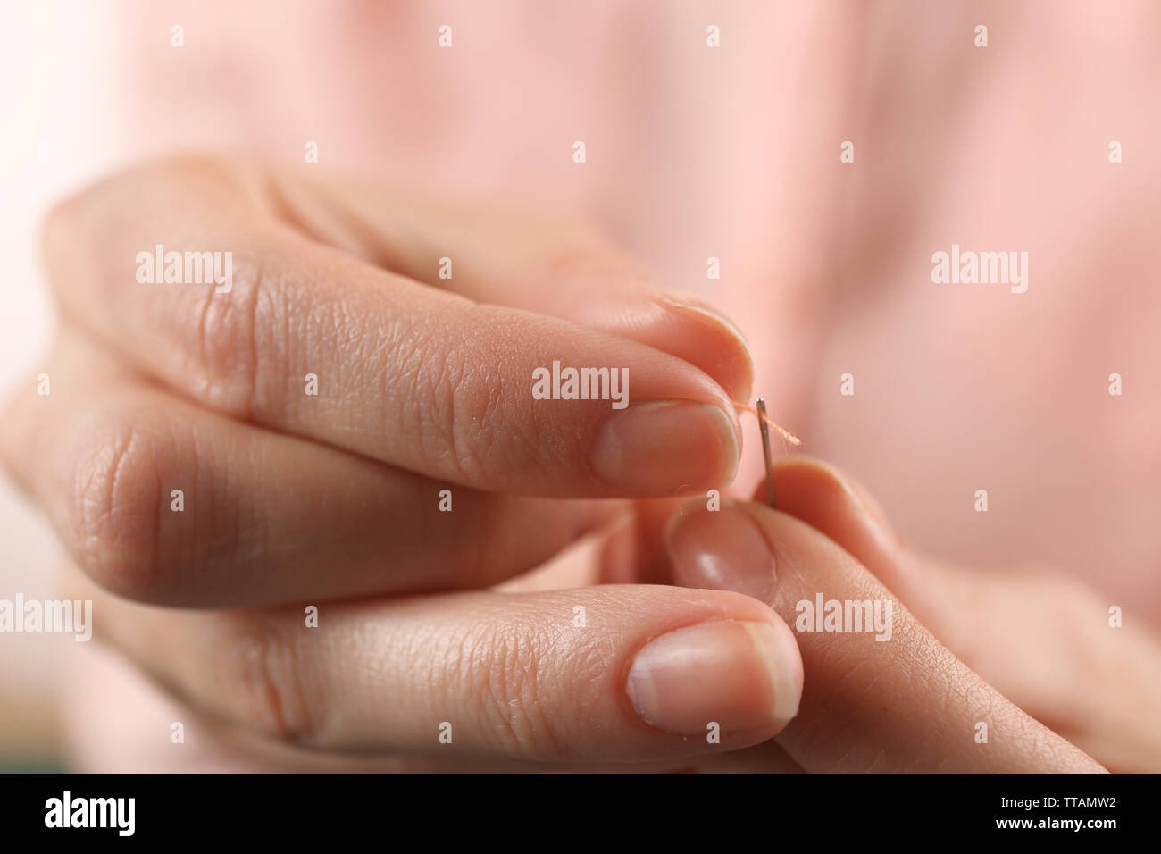 Closeup hands of seamstress at work Stock Photo - Alamy
