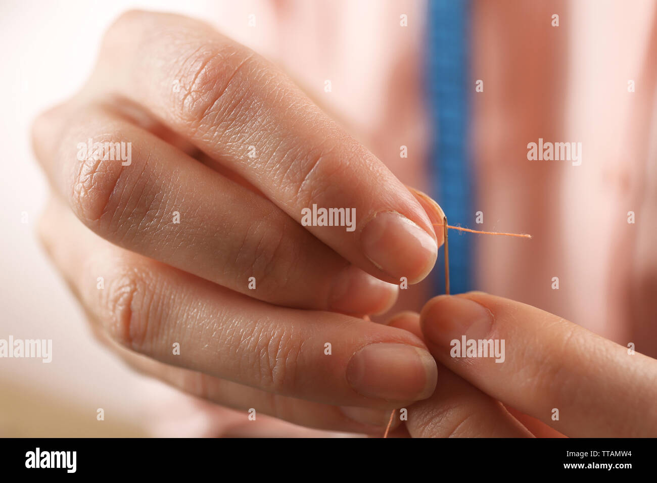 Closeup hands of seamstress at work Stock Photo - Alamy
