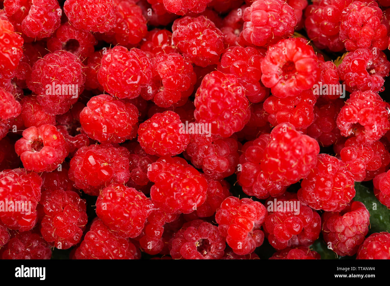 Sweet raspberries background Stock Photo - Alamy