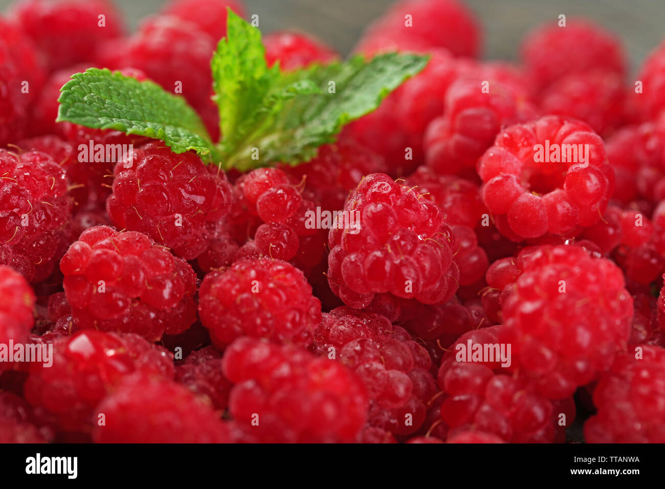 Sweet raspberries background Stock Photo - Alamy