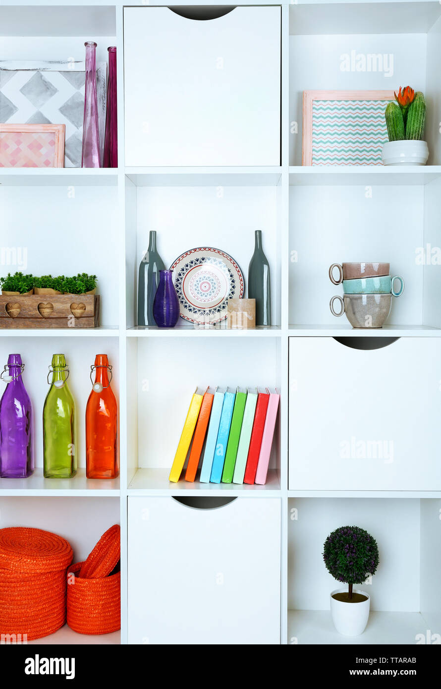 Beautiful white shelves with different home objects Stock Photo - Alamy