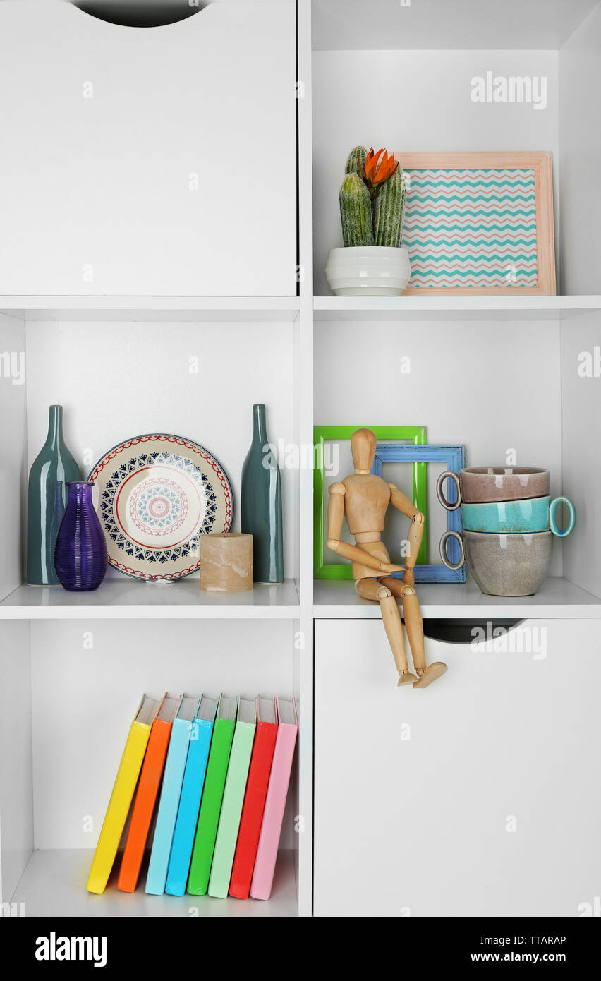 Beautiful white shelves with different home objects Stock Photo - Alamy