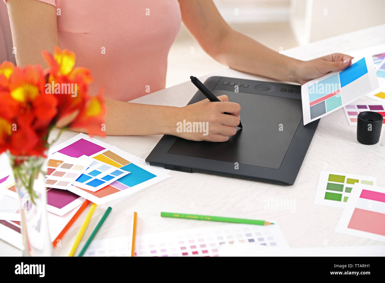 Artist drawing on graphic tablet in office Stock Photo - Alamy