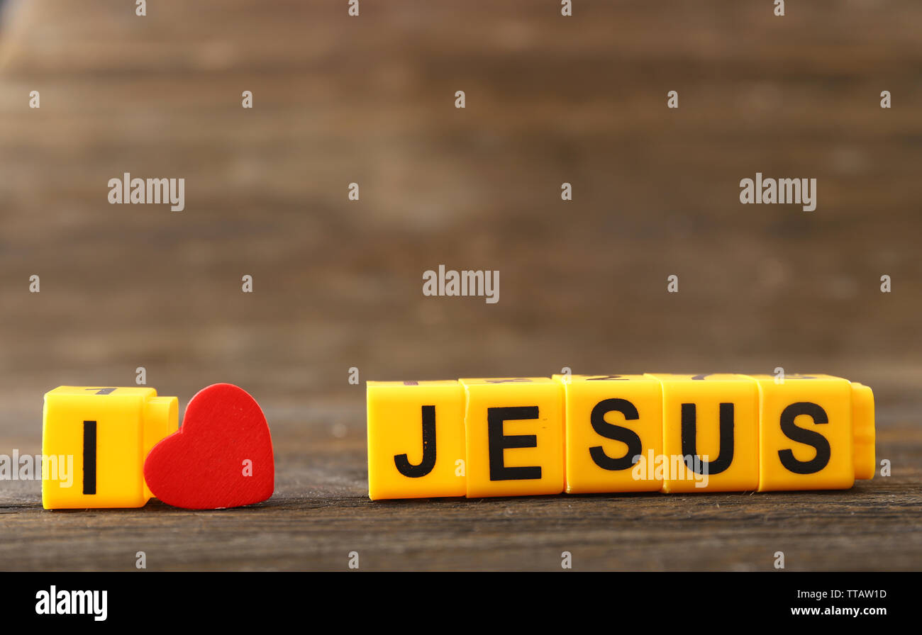 I LOVE JESUS sign illustrated with yellow plastic letters on wooden ...