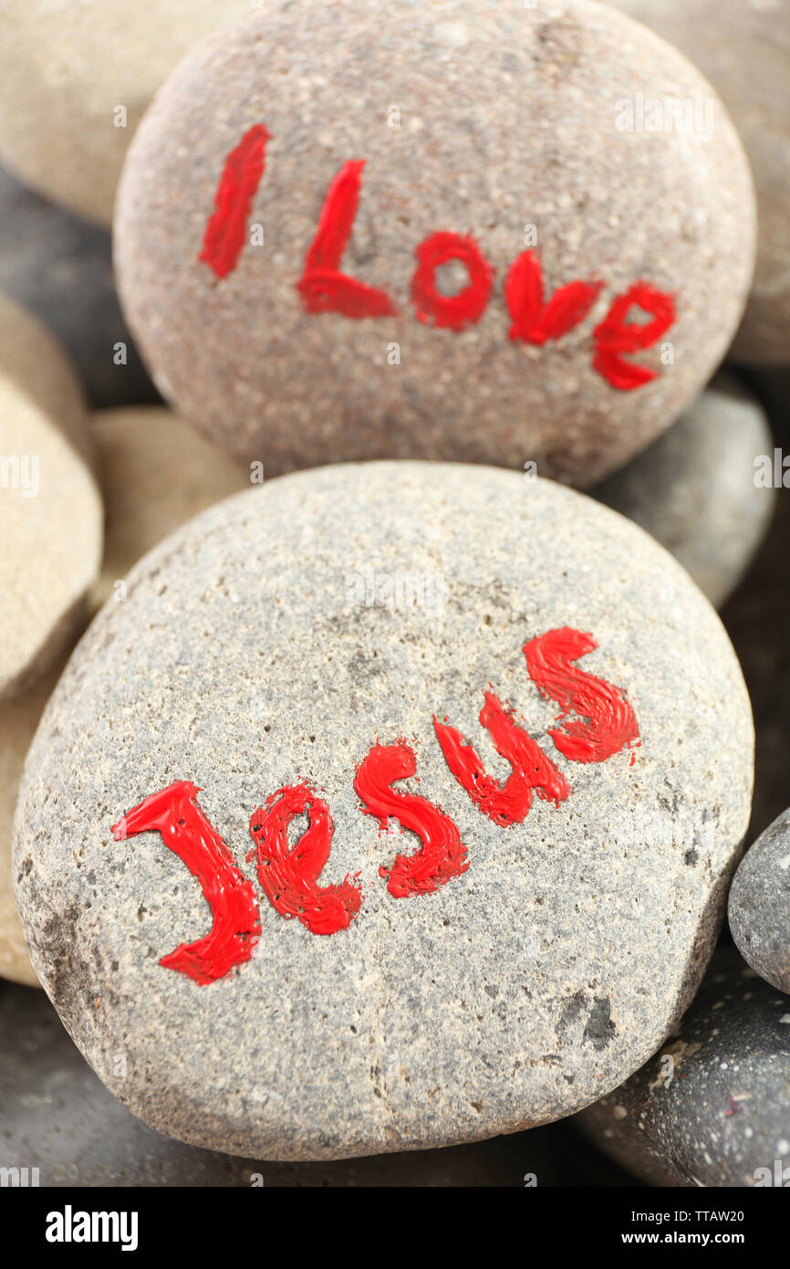 Pebbles with inscription I LOVE JESUS, closeup Stock Photo - Alamy