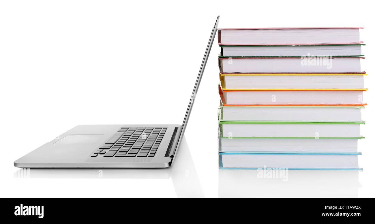 Stack of books with laptop isolated on white Stock Photo - Alamy