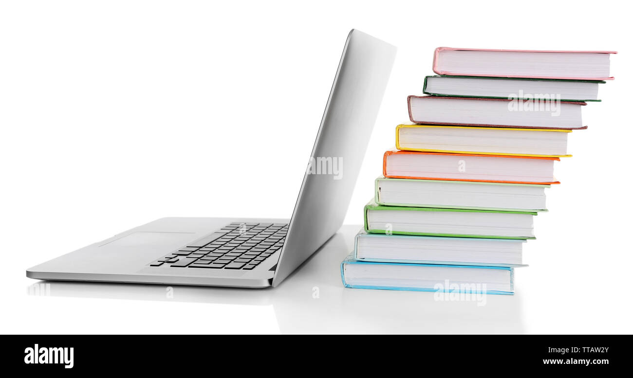 Stack of books with laptop isolated on white Stock Photo - Alamy