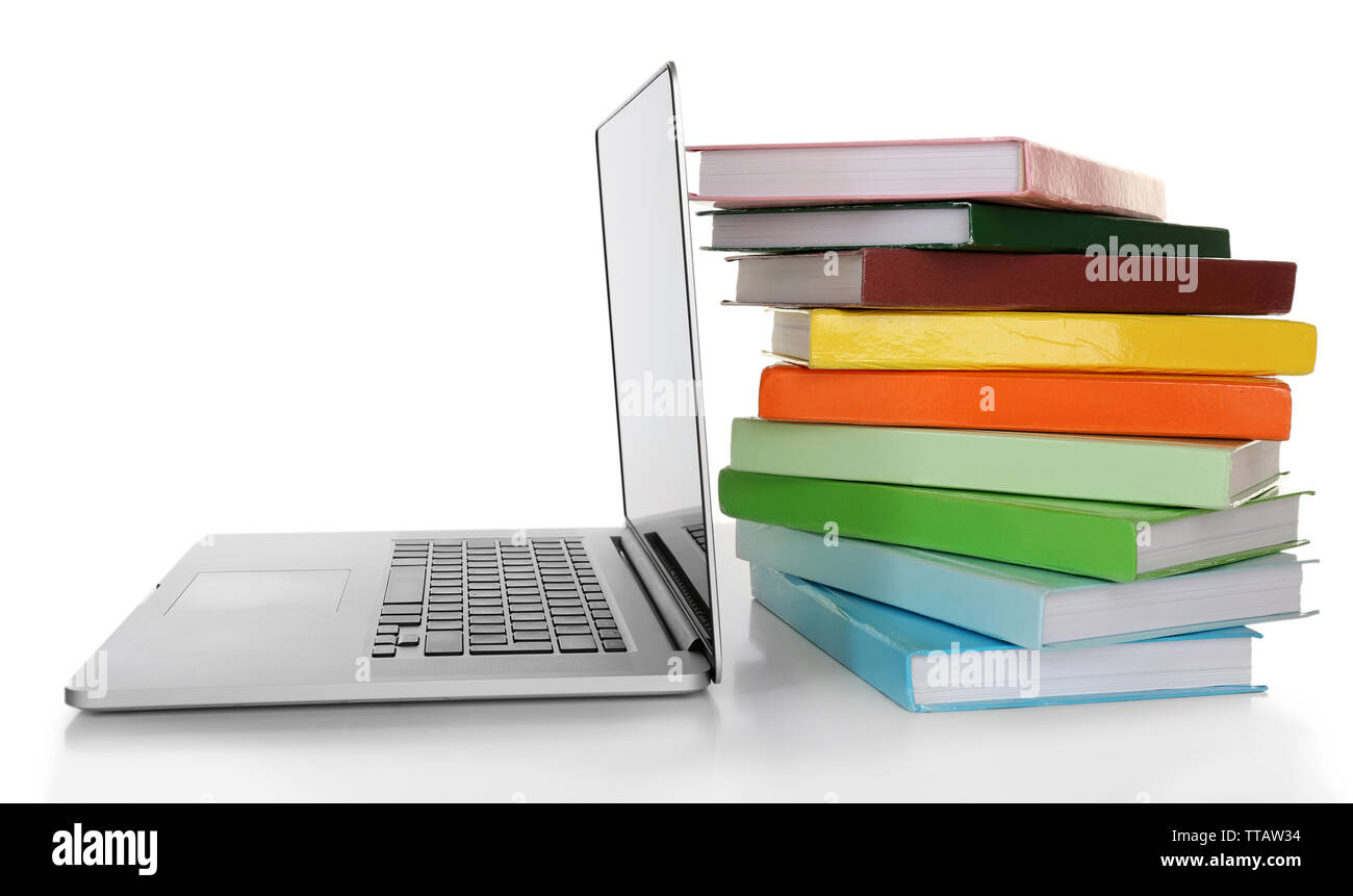 Stack of books with laptop isolated on white Stock Photo - Alamy