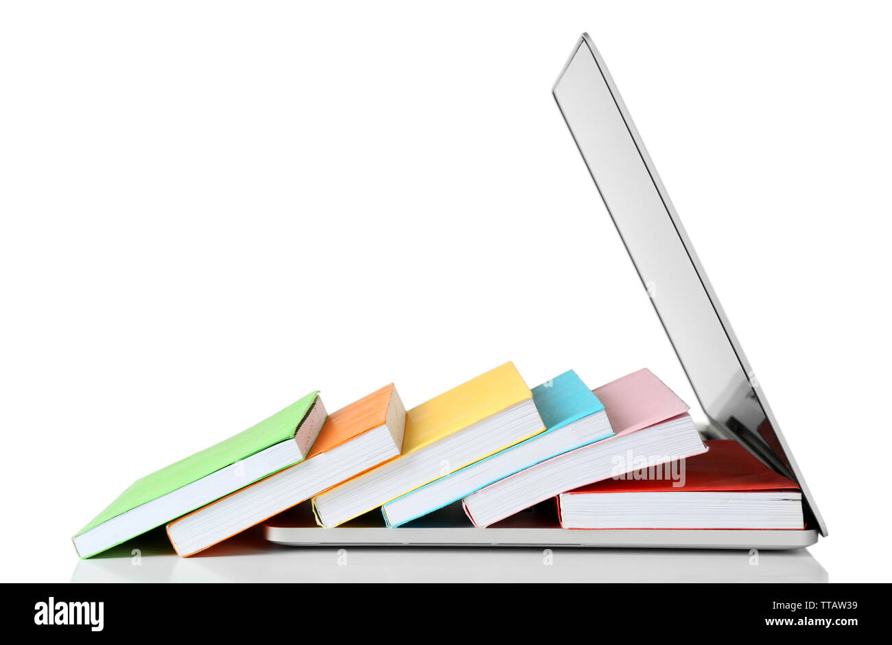 Stack of books with laptop isolated on white Stock Photo - Alamy