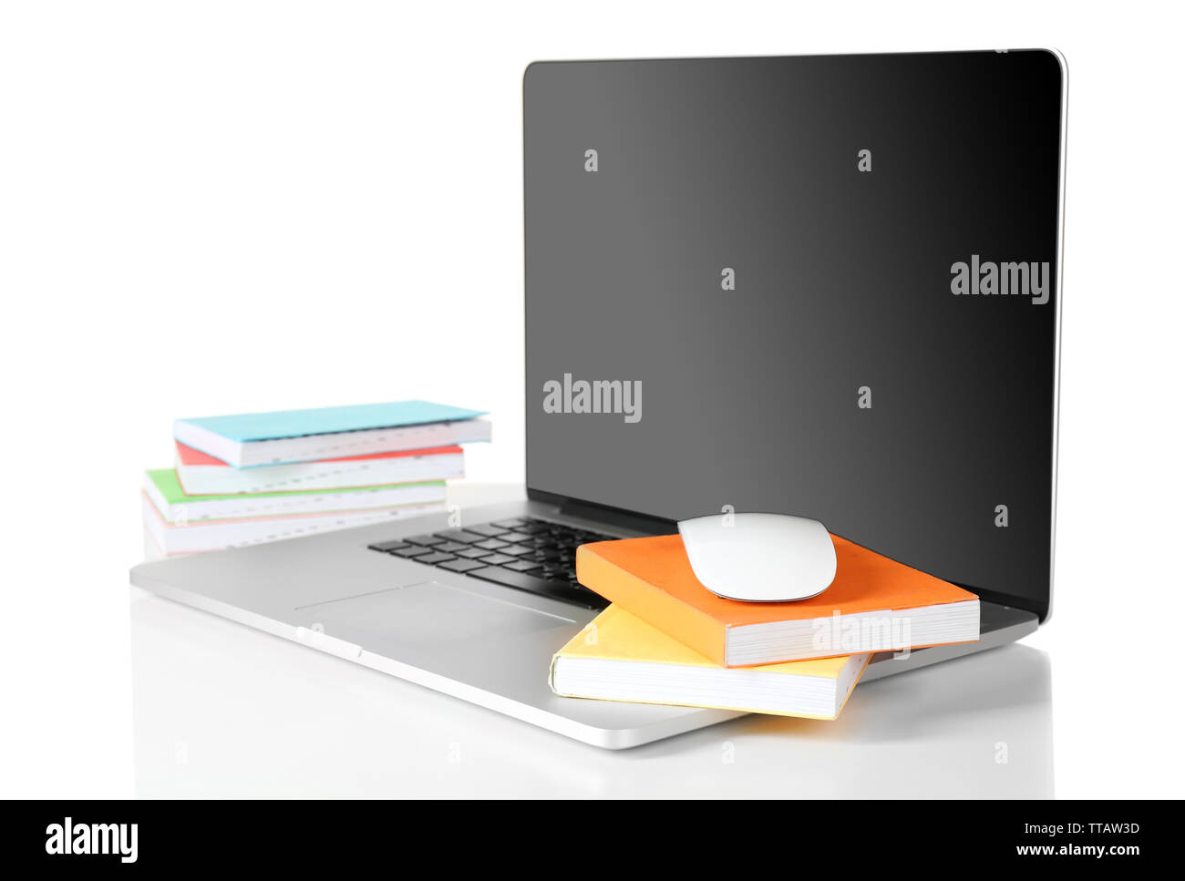 Stack of books with laptop close up Stock Photo - Alamy
