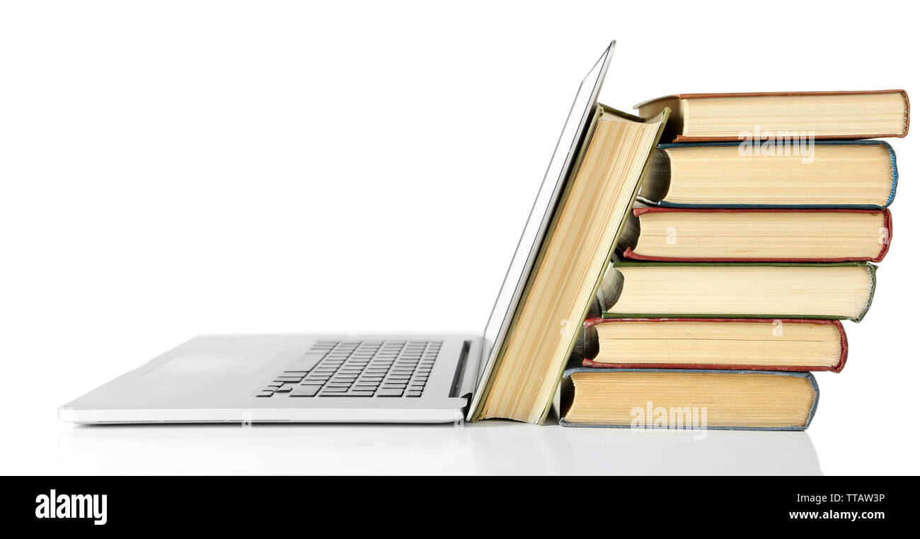 Stack of books with laptop isolated on white Stock Photo - Alamy