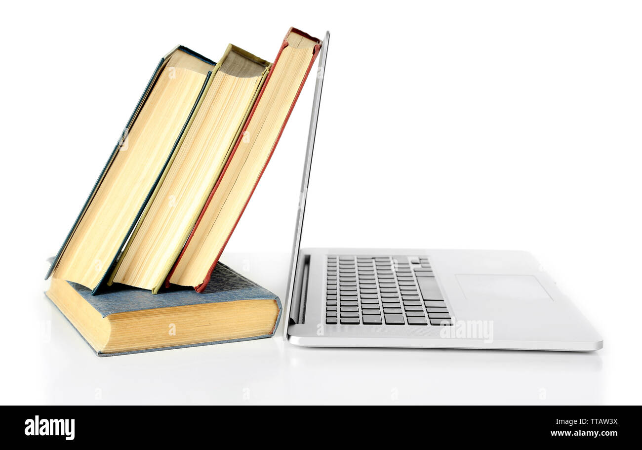 Stack of books with laptop isolated on white Stock Photo - Alamy