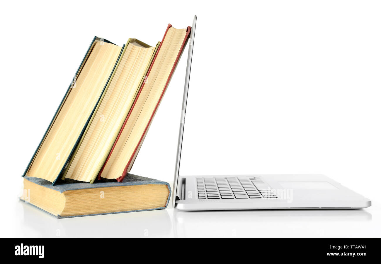 Stack of books with laptop isolated on white Stock Photo - Alamy