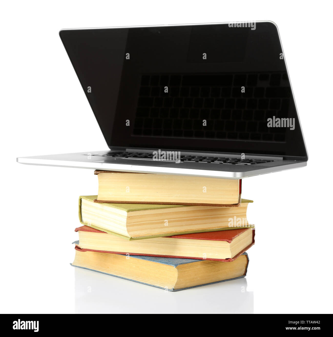 Stack of books with laptop isolated on white Stock Photo - Alamy