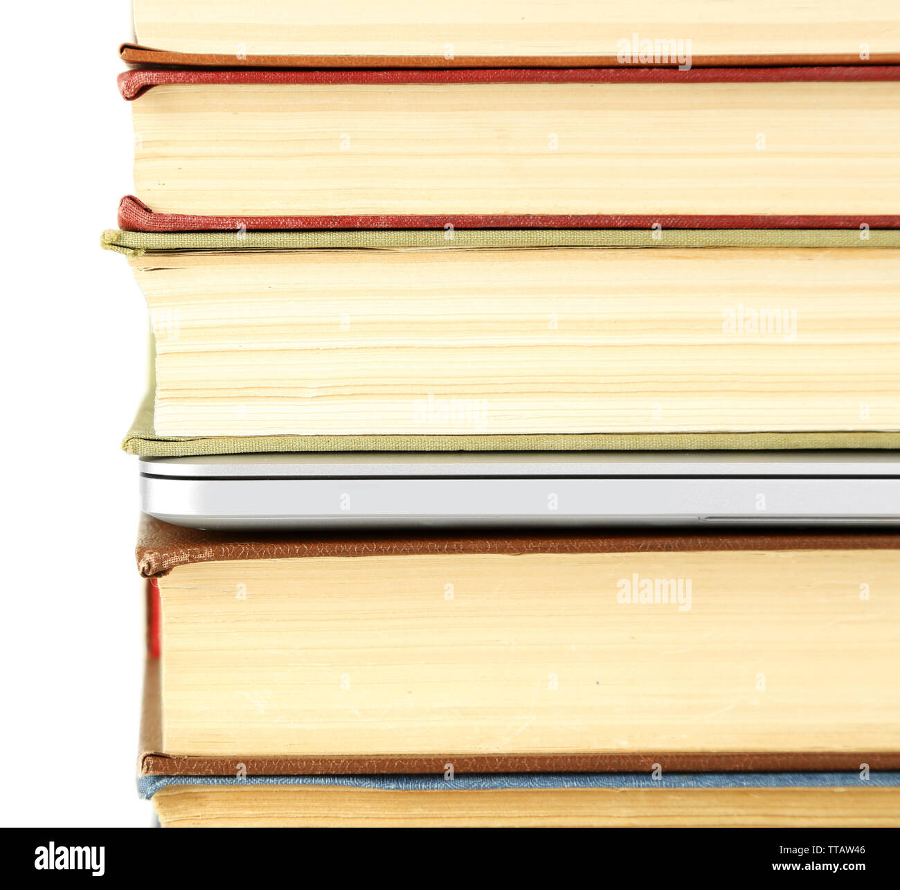Stack of books with laptop close up Stock Photo - Alamy