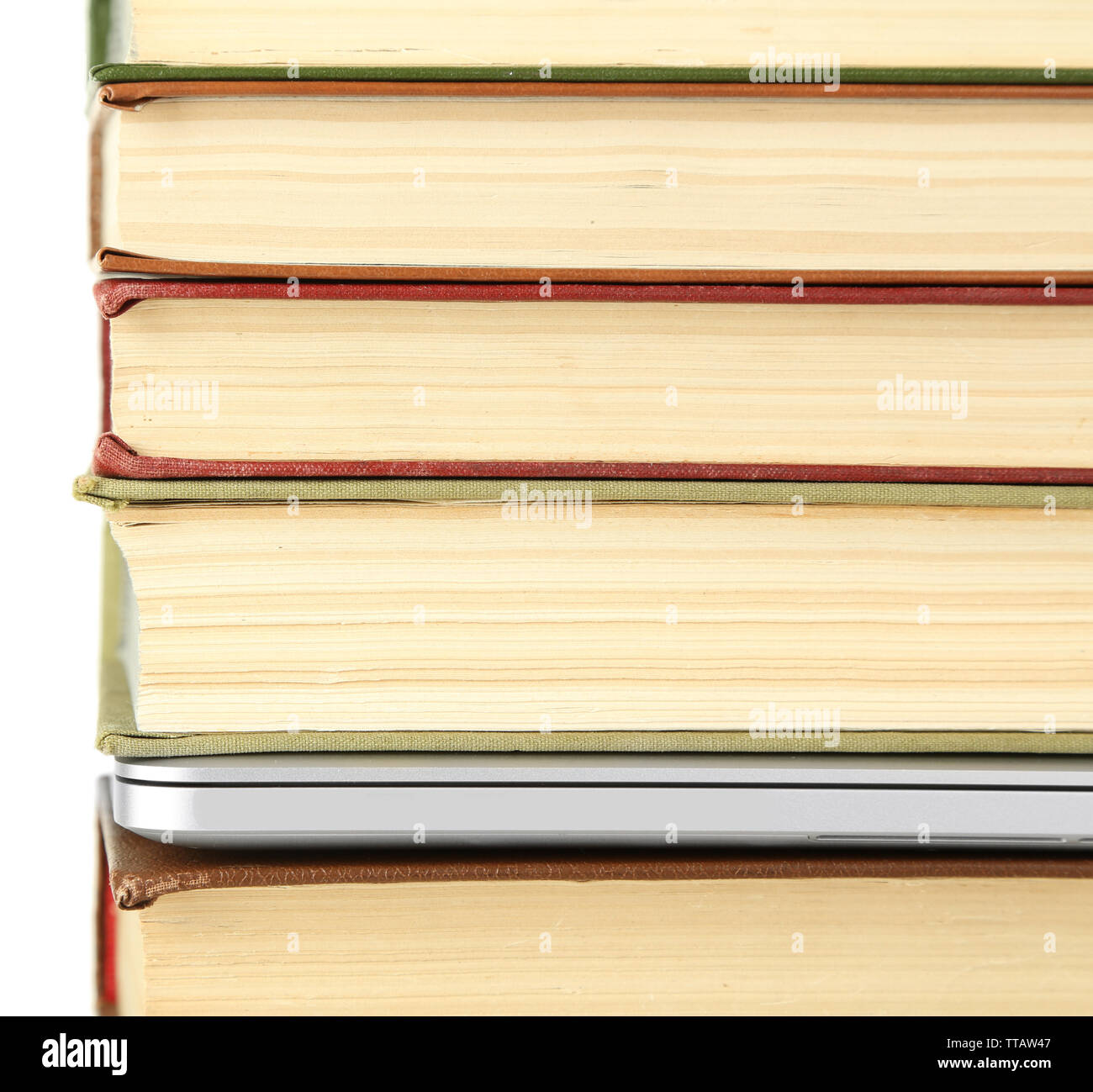 Stack of books with laptop close up Stock Photo - Alamy