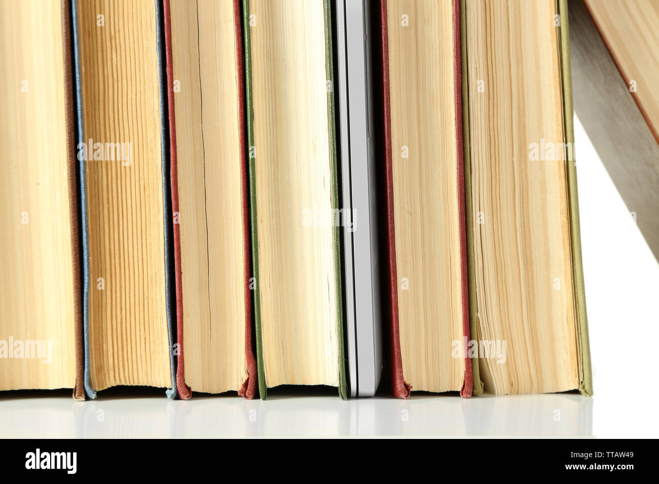 Stack of books with laptop close up Stock Photo - Alamy