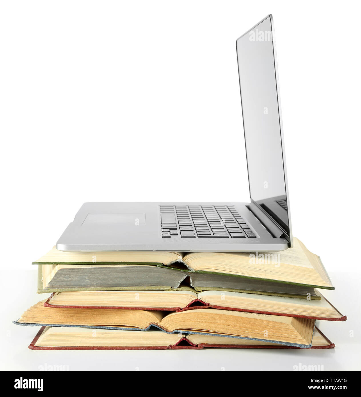 Stack of books with laptop isolated on white Stock Photo - Alamy