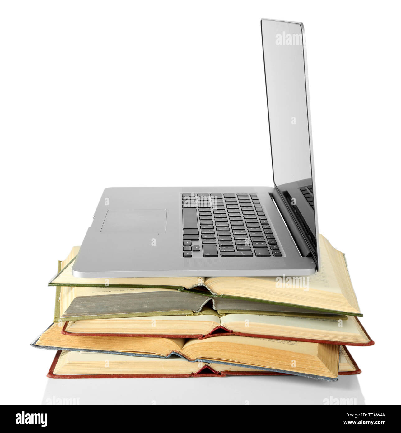 Stack of books with laptop isolated on white Stock Photo - Alamy