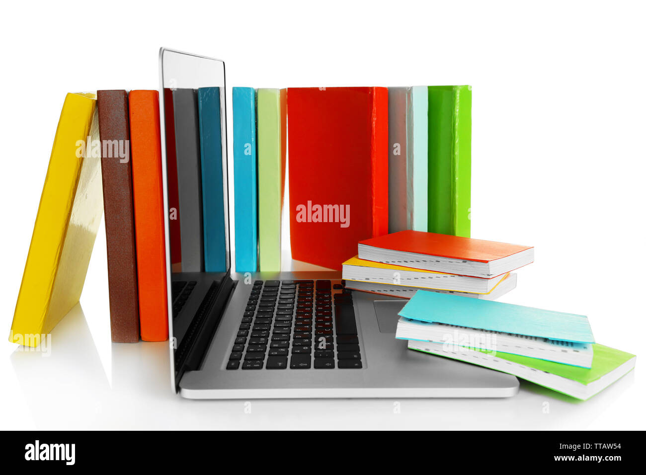 Stack of books with laptop isolated on white Stock Photo - Alamy