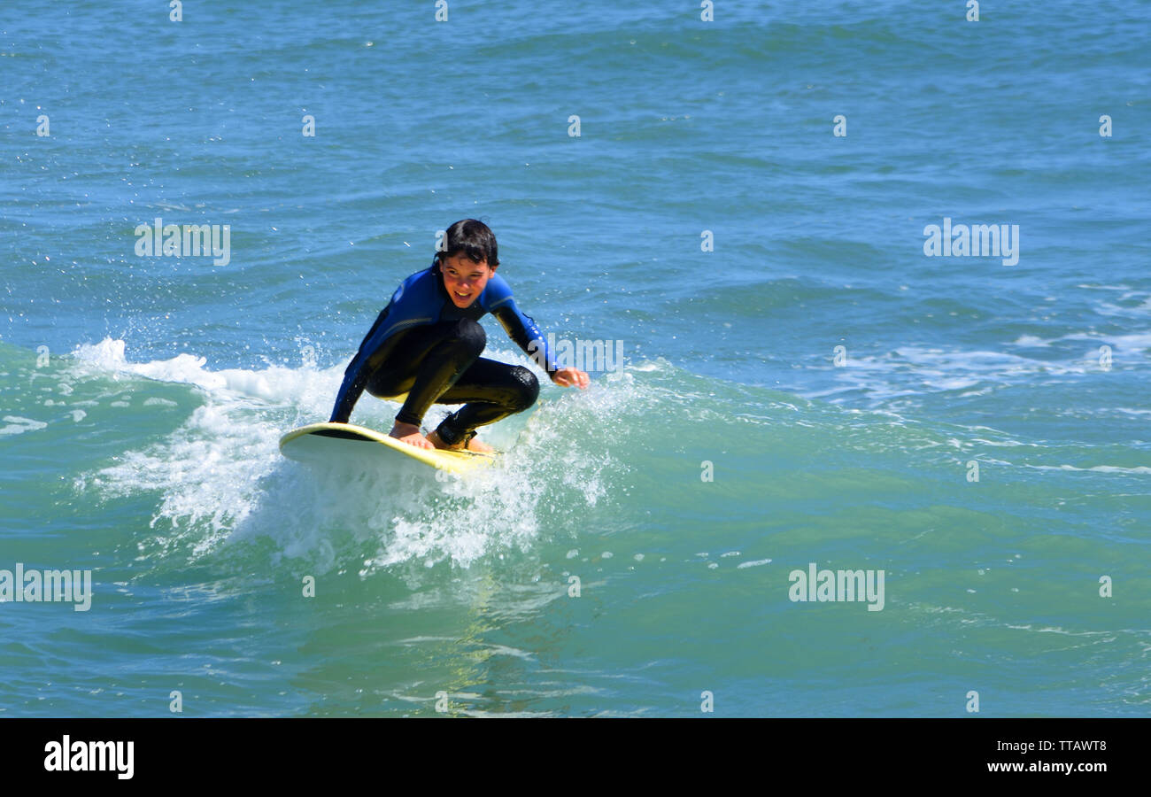 Man wet suit surfing wave hi-res stock photography and images - Alamy