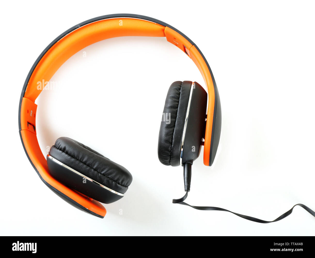 Orange headphones isolated on white Stock Photo - Alamy