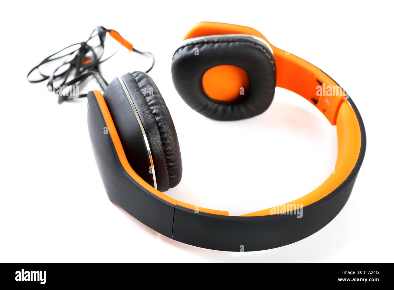 Orange headphones isolated on white Stock Photo - Alamy