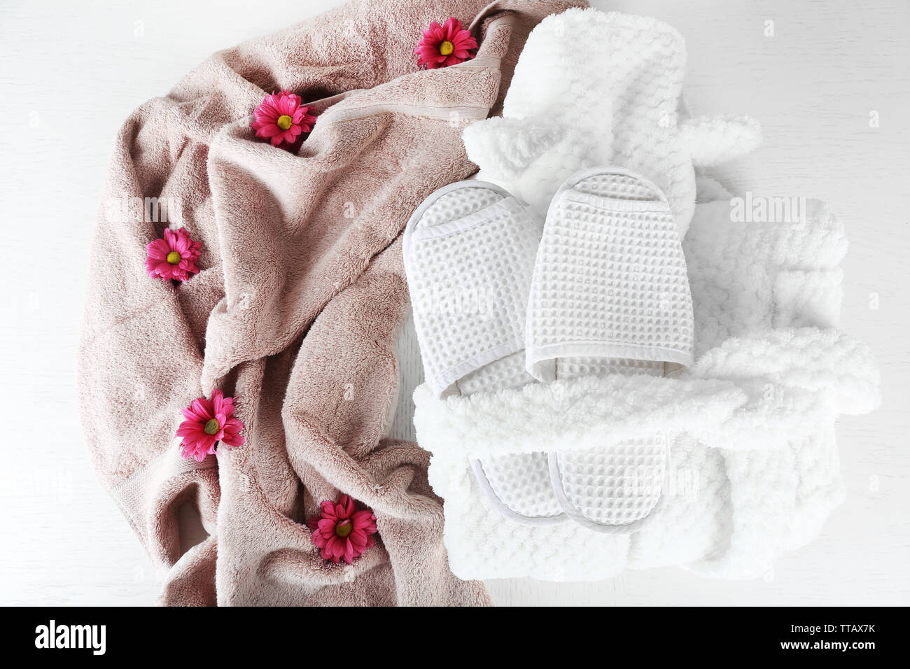 White bathrobe towel hi-res stock photography and images - Alamy
