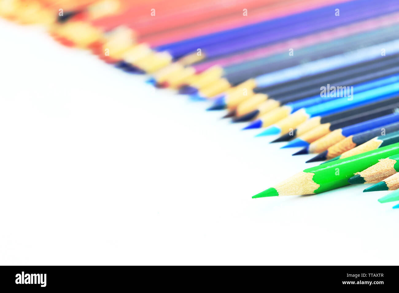 colored pencils rainbow colors row lined on upper side with copy space ...