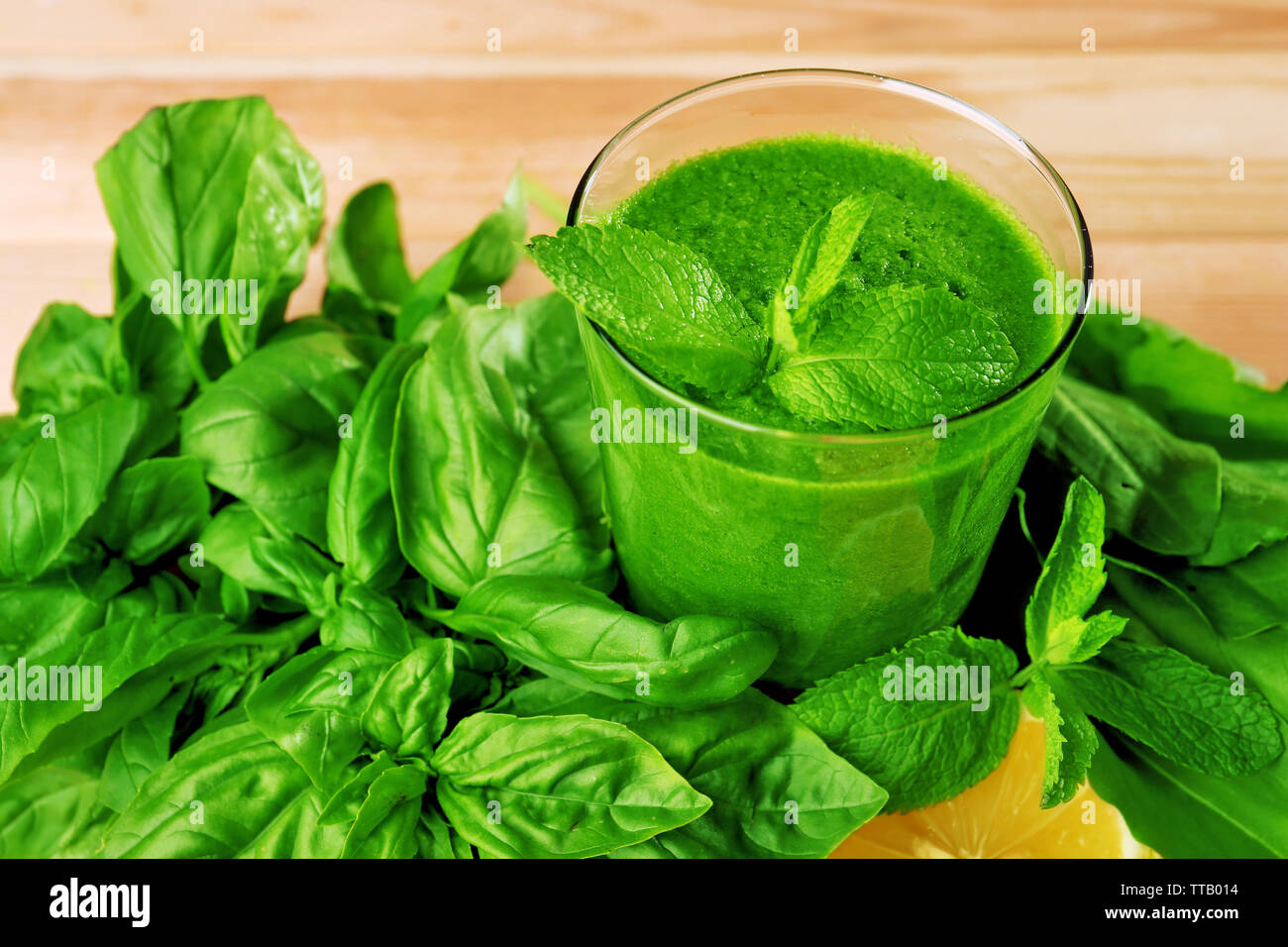 Green healthy juice with herbs close up Stock Photo - Alamy