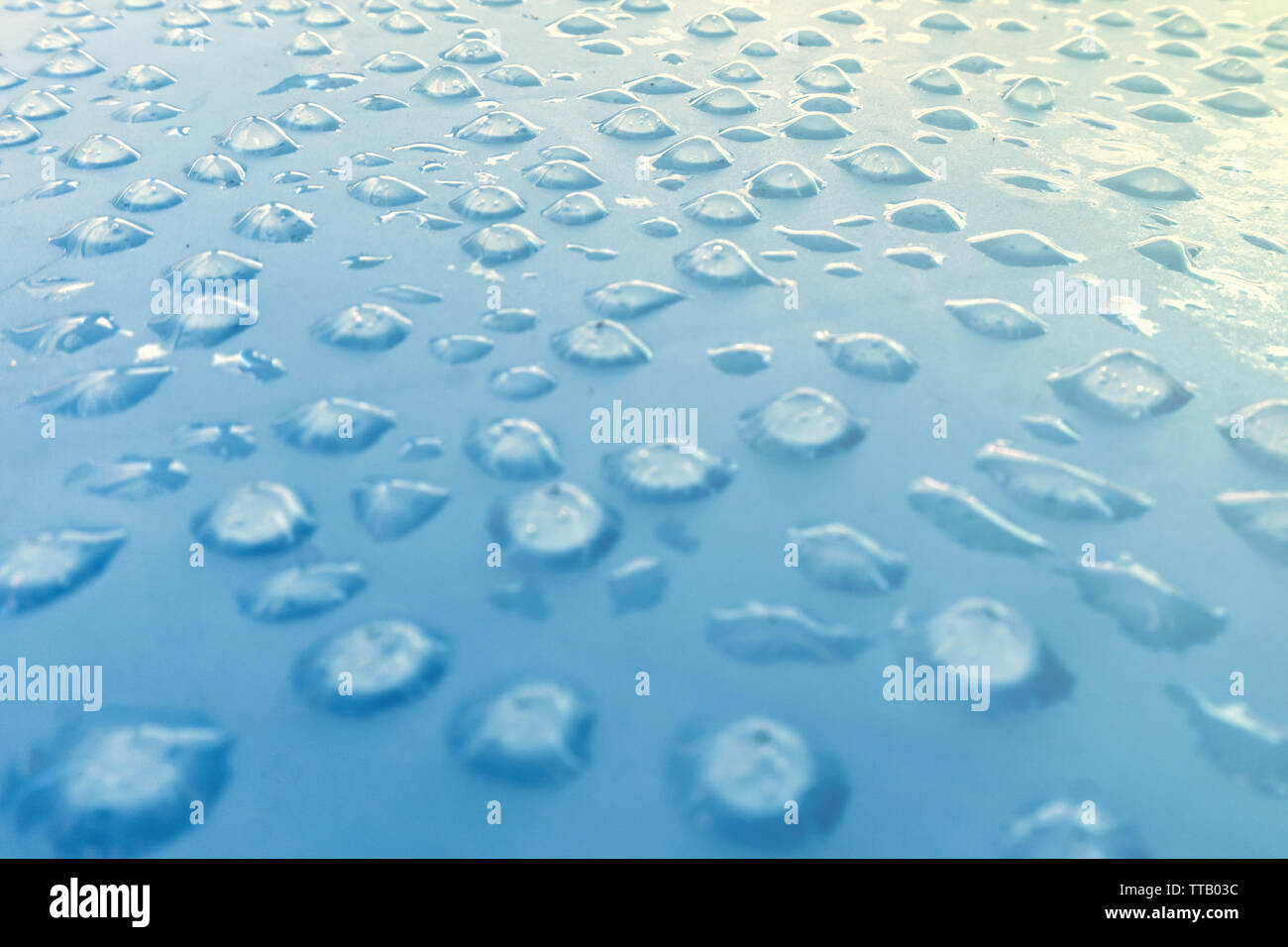 Blue wall after rain condensation walls. A drop of water on the wall ...