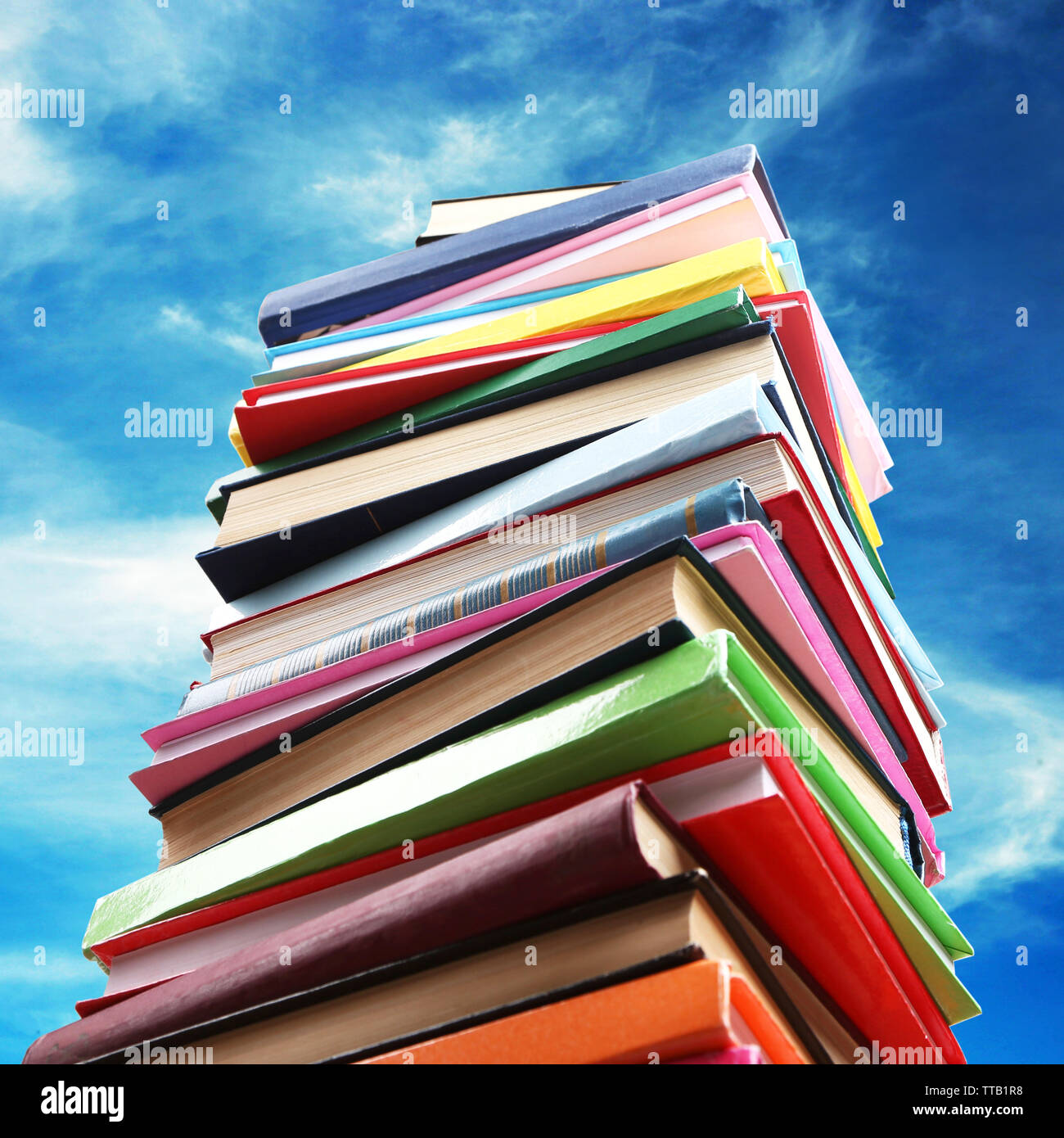 Concept accumulation of knowledge on sky background Stock Photo - Alamy