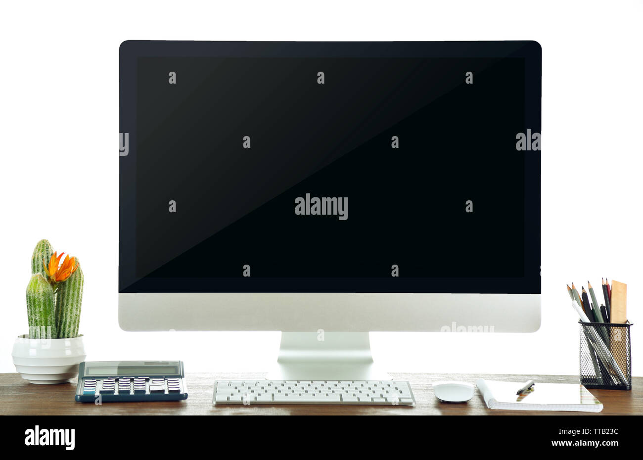 Computer on wooden table with blank white background Stock Photo - Alamy