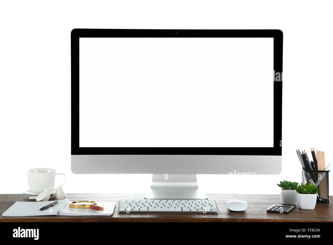 Computer on wooden table with blank white background Stock Photo - Alamy