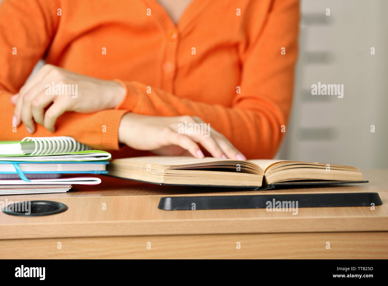 Student reading book, close-up Stock Photo - Alamy