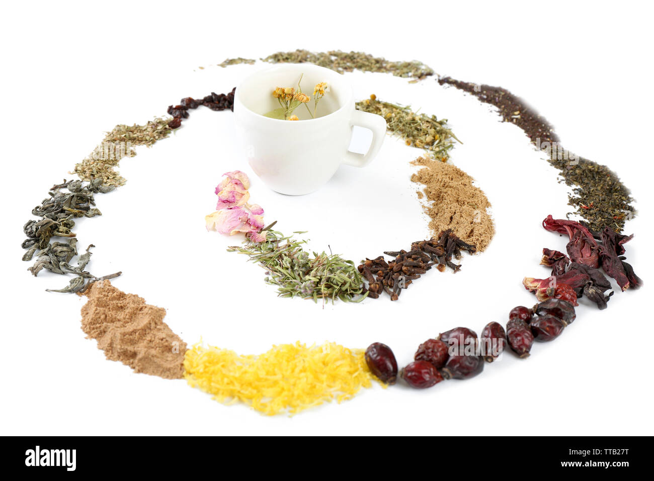 Cup of herbal tea with various kinds of dried herbs isolated on white ...