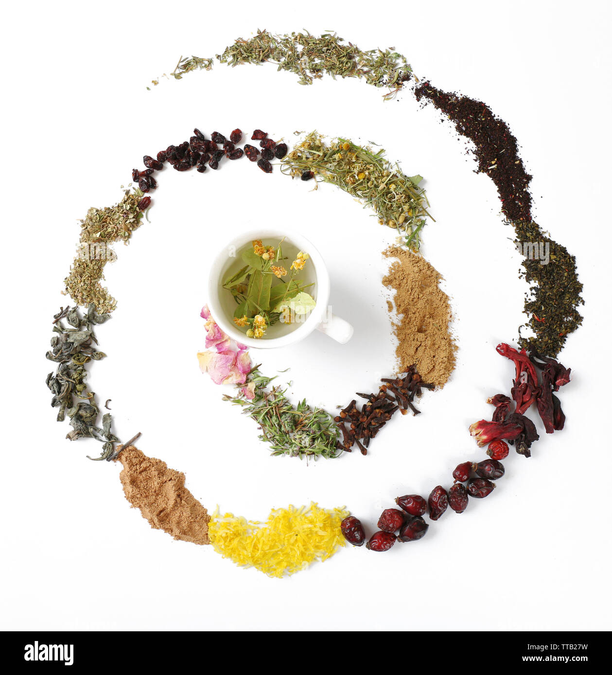 Cup of herbal tea with various kinds of dried herbs isolated on white ...