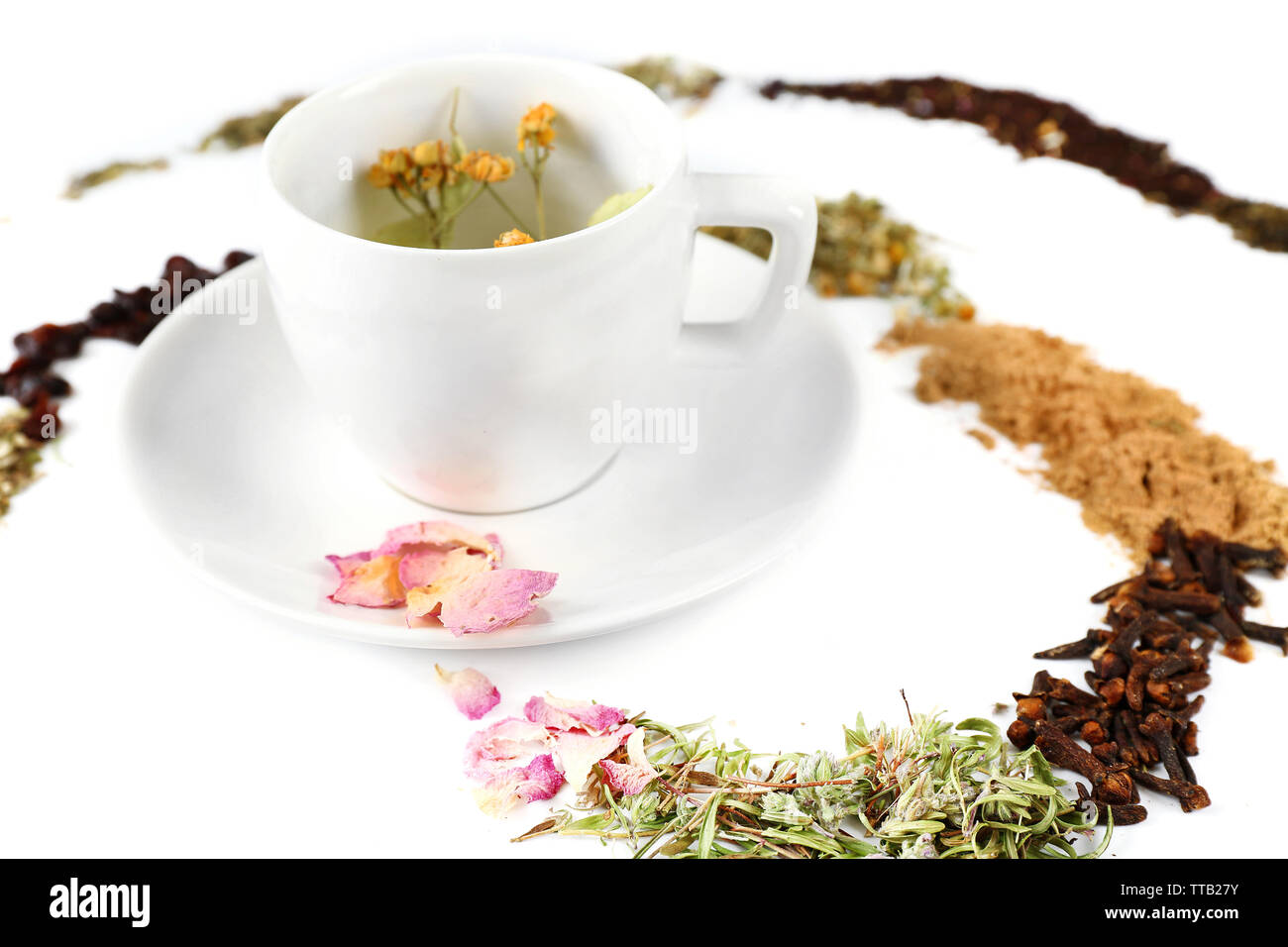 Cup of herbal tea with various kinds of dried herbs isolated on white ...