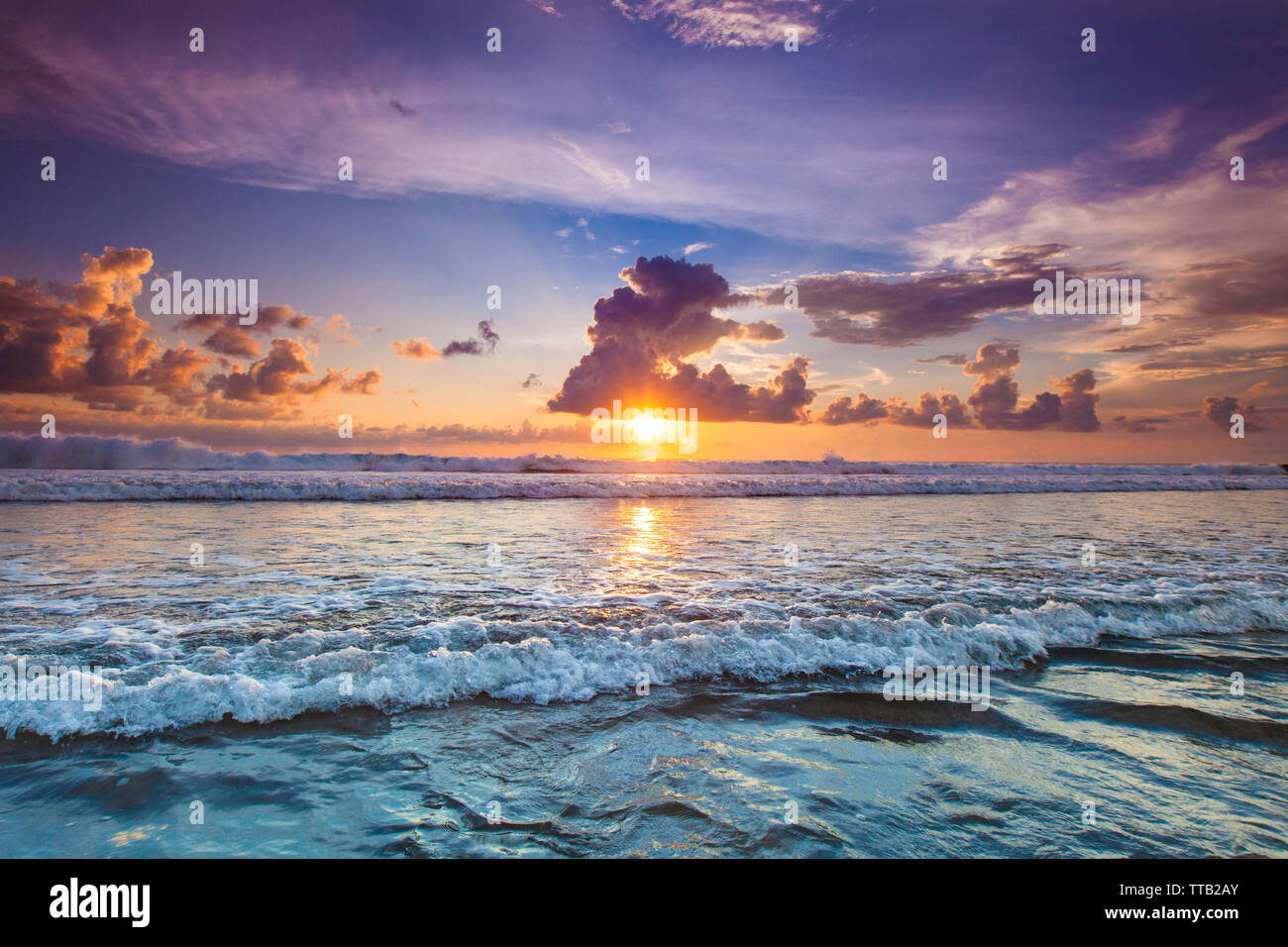 Radiant colorful sea beach sunset on Bali, Indonesia Stock Photo - Alamy