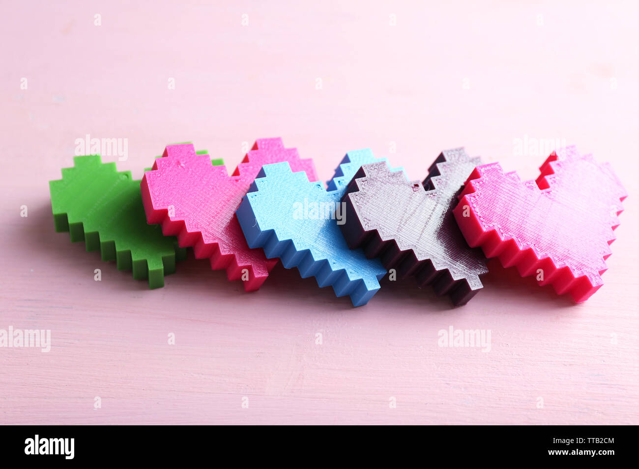 Plastic hearts on wooden background Stock Photo - Alamy