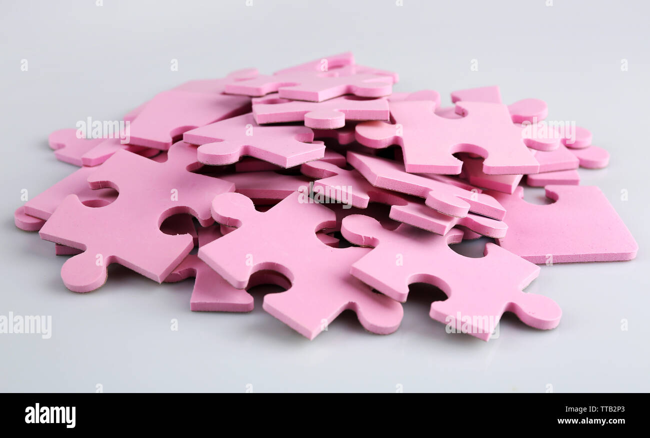 Pile of puzzle pieces isolated on white Stock Photo - Alamy