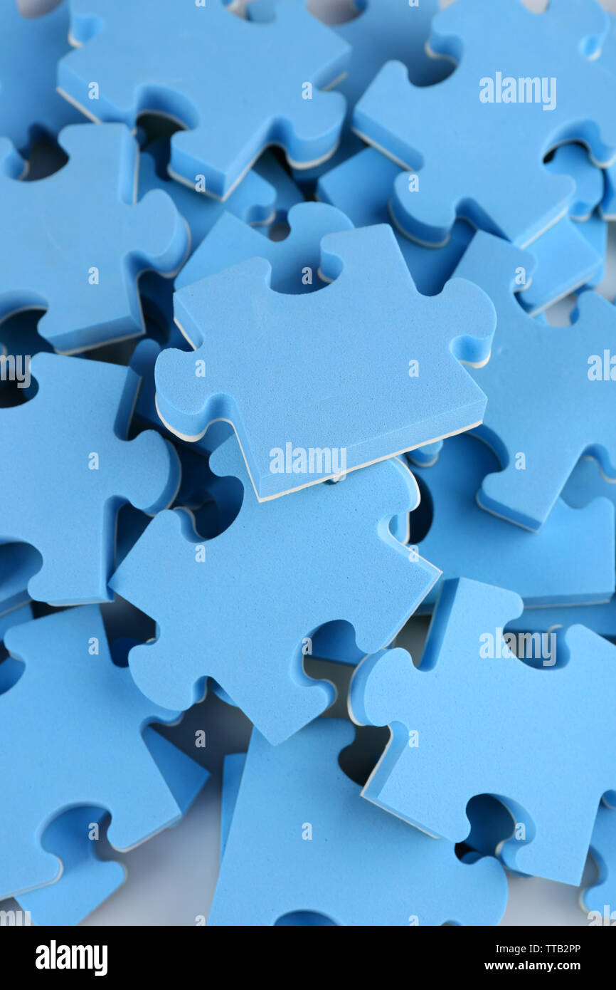 Pile of blue puzzle pieces, closeup Stock Photo - Alamy