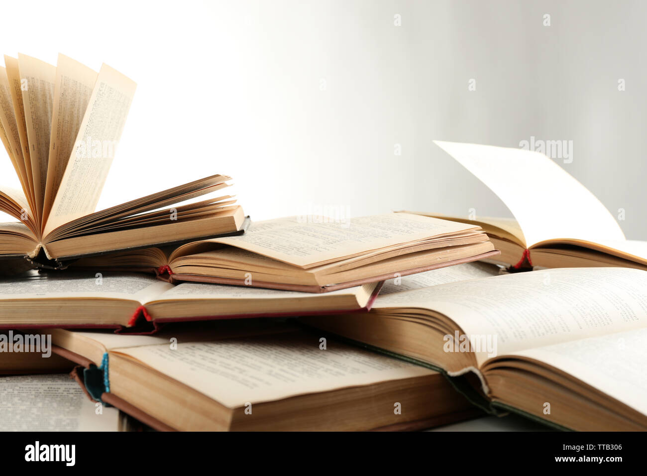 Many open books isolated on white Stock Photo - Alamy