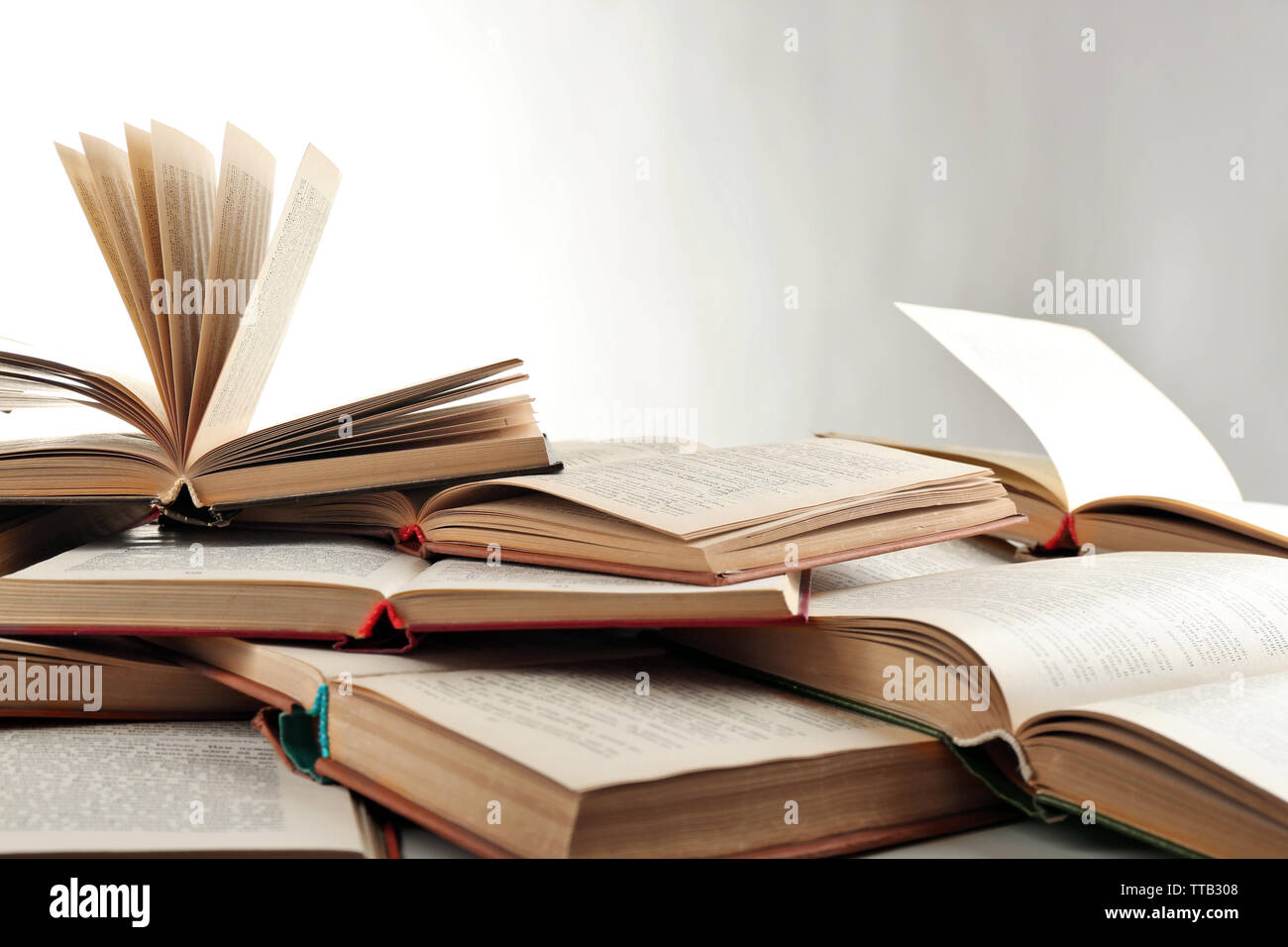 Many open books isolated on white Stock Photo - Alamy