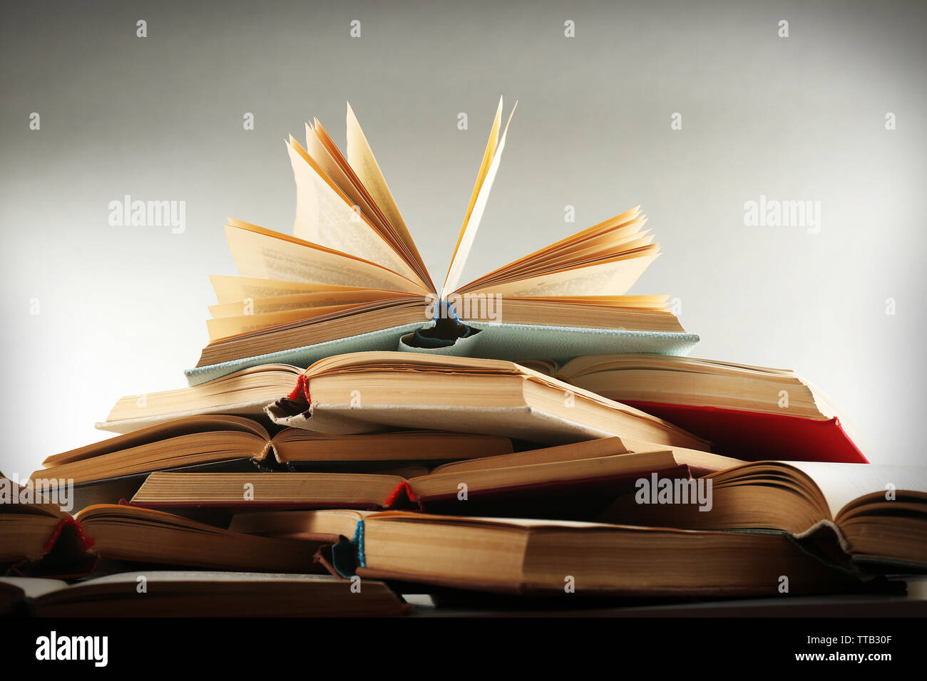 Many open books isolated on white Stock Photo - Alamy